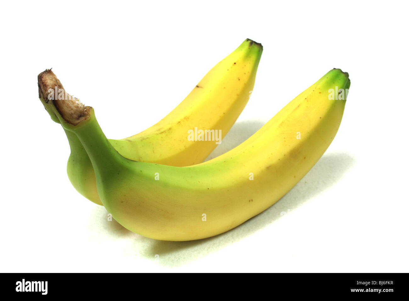 two yellow bananas on a white background Stock Photo - Alamy