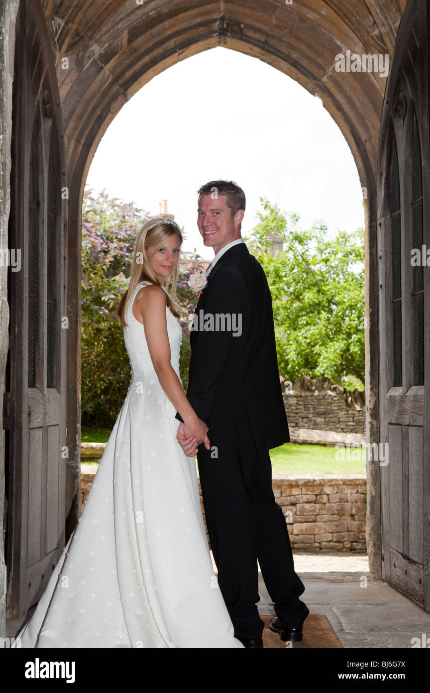 Bride And Groom Poses In Church
