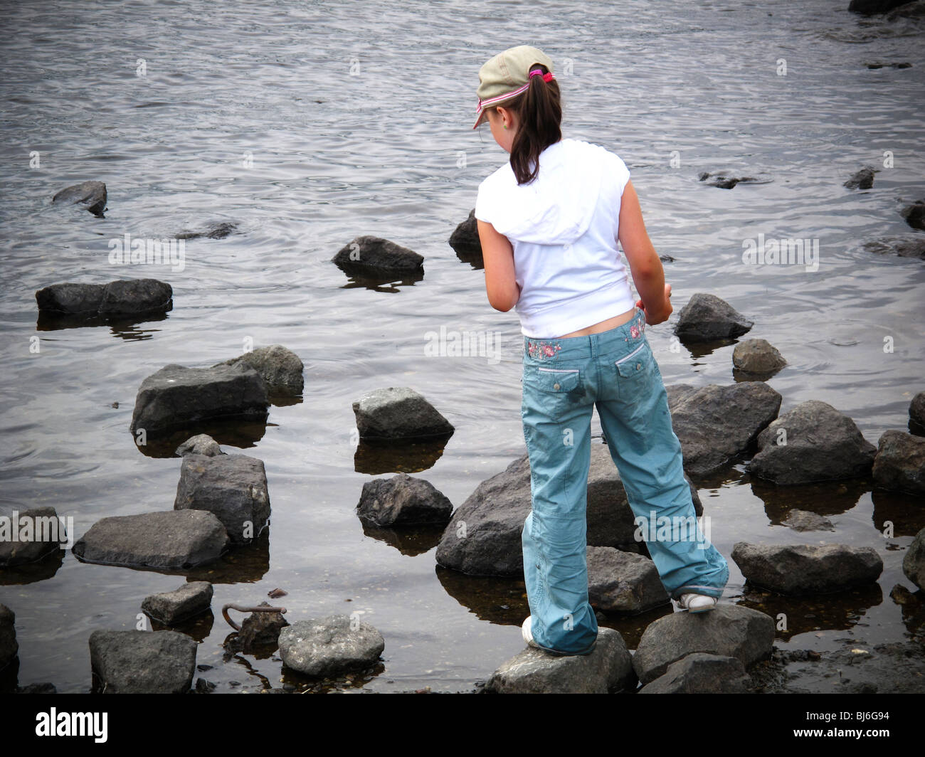 Child playing with rocks hi-res stock photography and images - Alamy