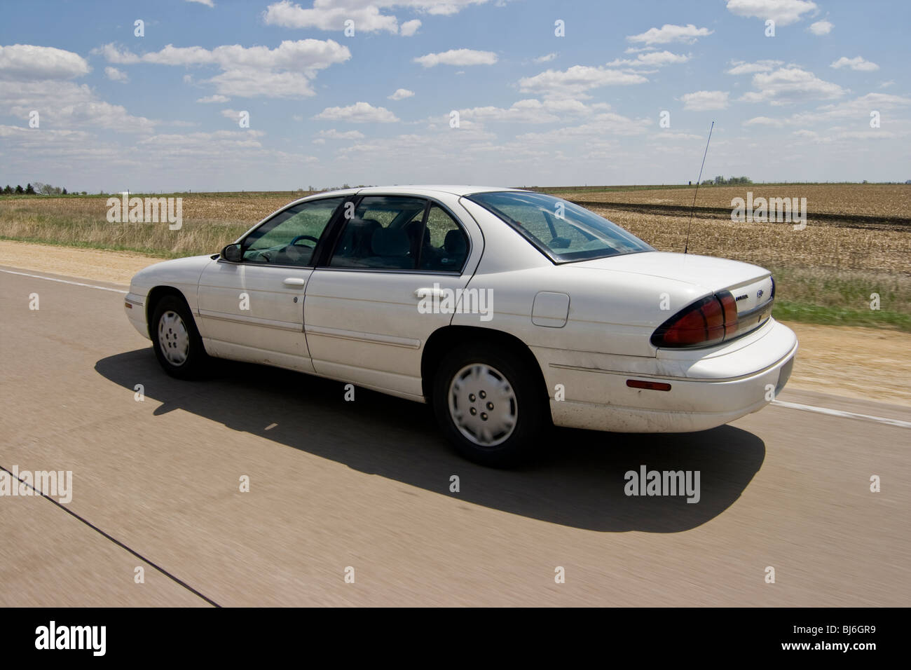Chevy Lumina 4 door driving down interstate Stock Photo - Alamy