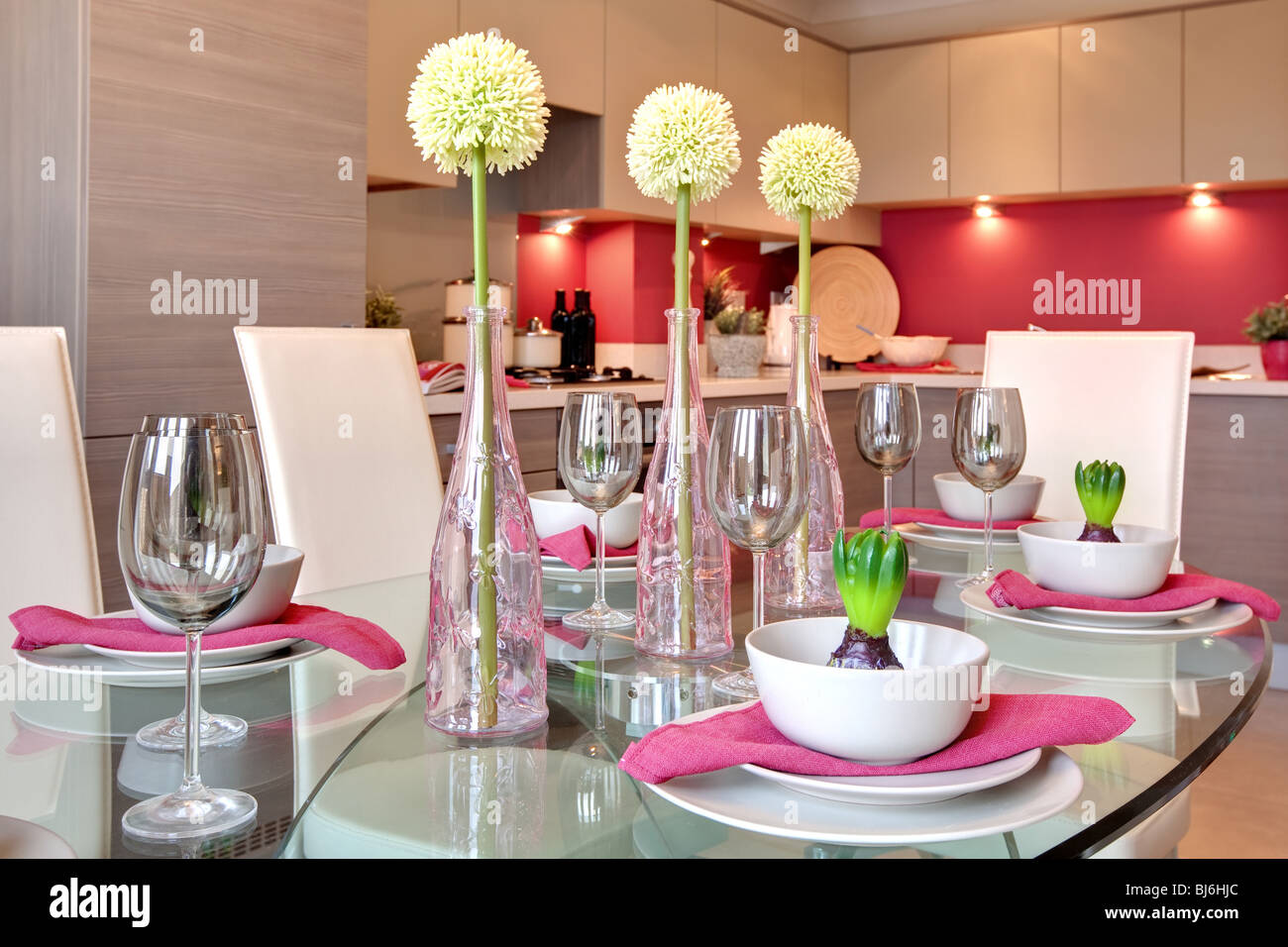 glamorous table setting ready for dinner party with kitchen background ...