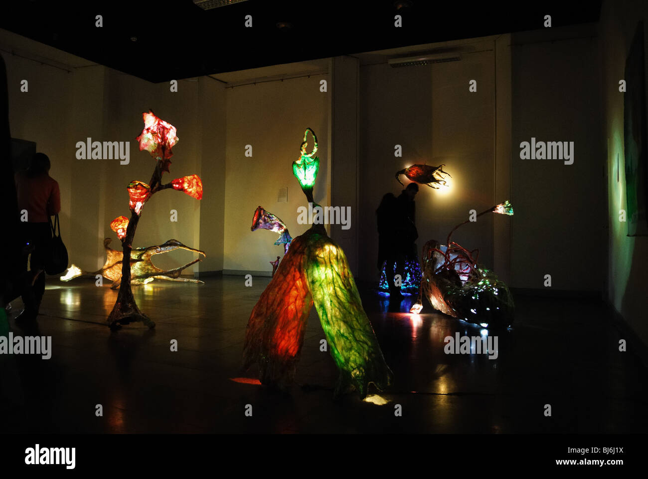 Visitors view illuminated sculptures displayed at a Great Sculpture ... Visitors view illuminated sculptures displayed at a Great Sculpture ...