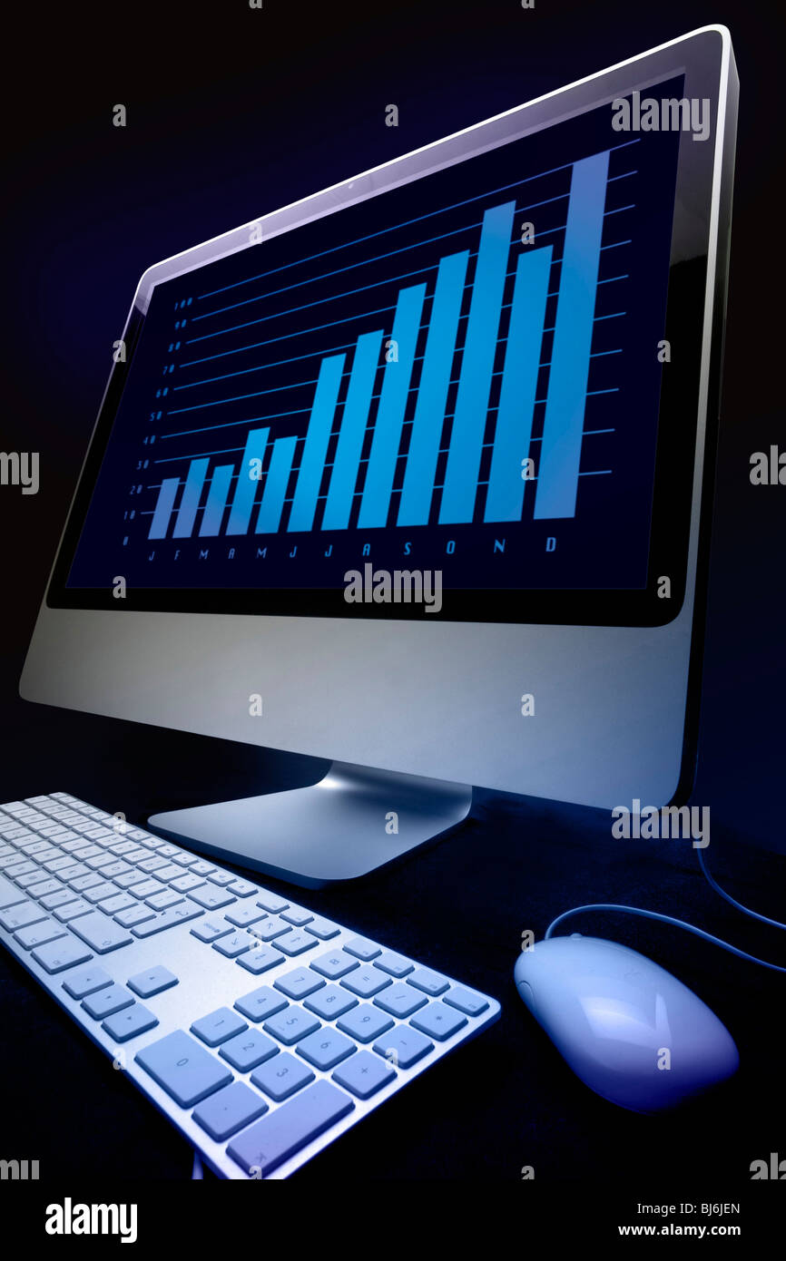 desktop computer with upward sales bar chart in blue on a black screen ...
