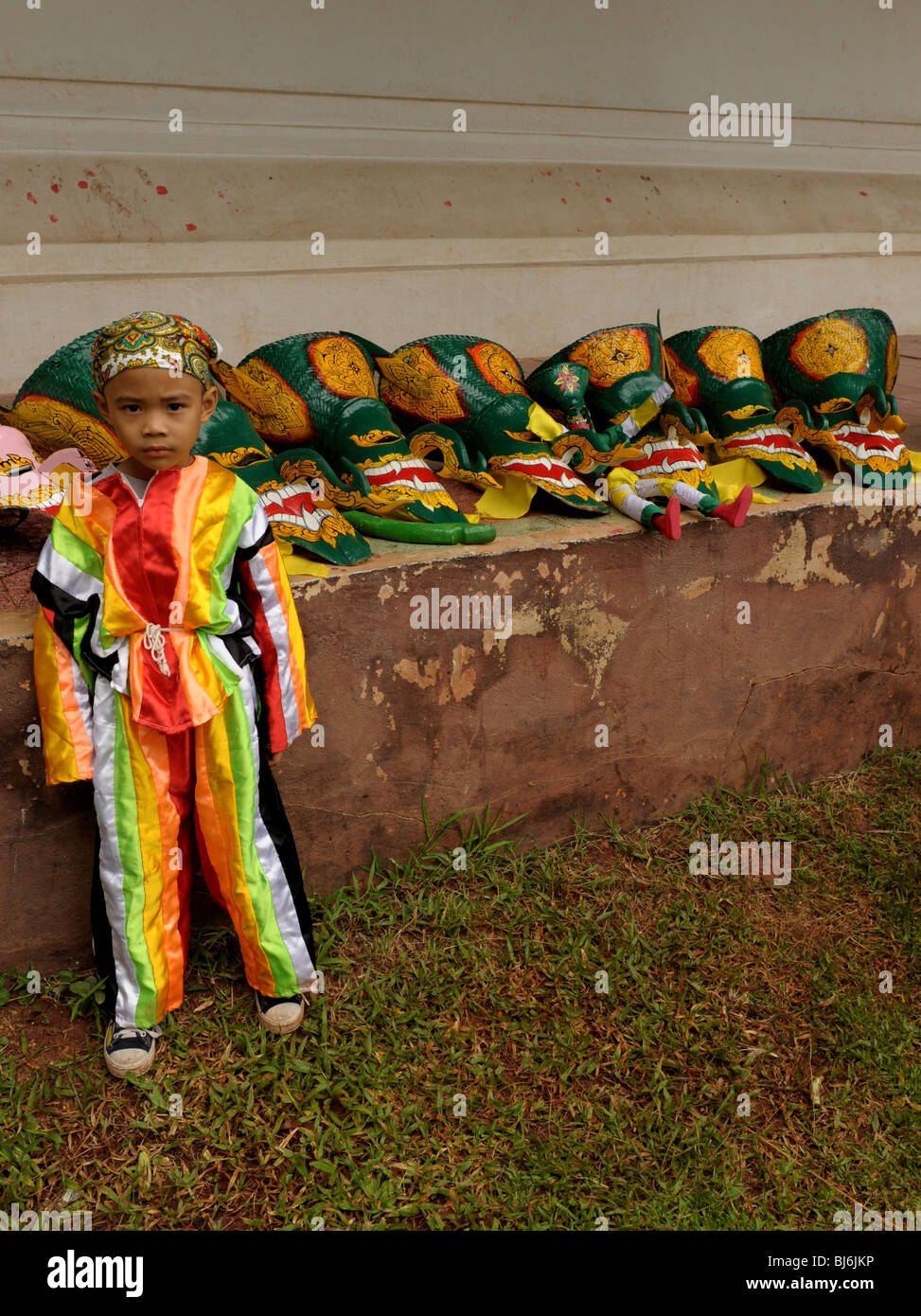 young boy posing next to ghost masks , pee ta khon (the ghost festival), dan sai , loei province ...
