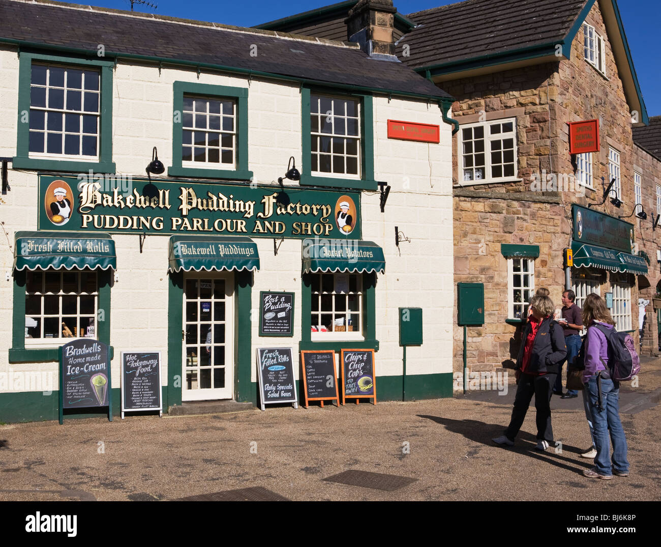 Tourists outside the Bakewell Pudding Factory shop Derbyshire England ...