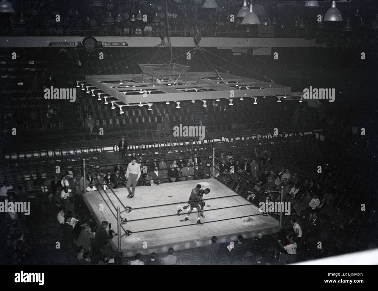 1950s. Two blacks in boxing match in indoor in the old arena where the ...
