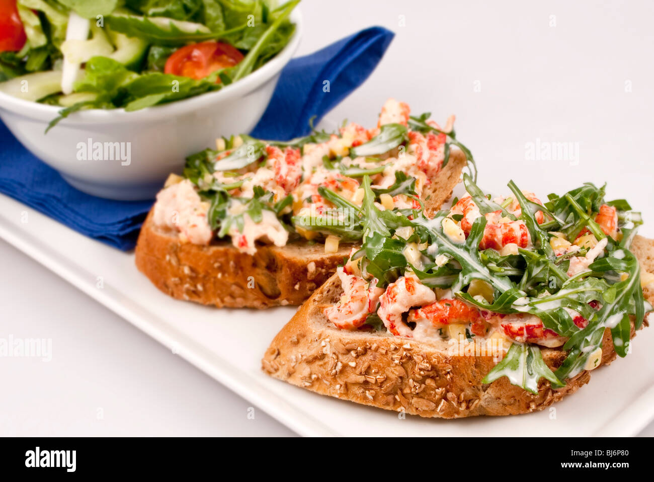 bowl of salad & seafood on bread Stock Photo - Alamy