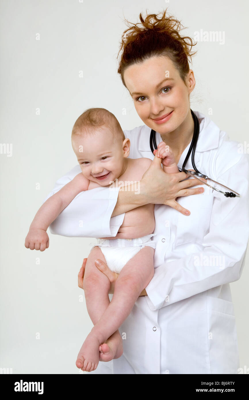 Young medical woman doctor with adorable newborn baby Stock Photo - Alamy
