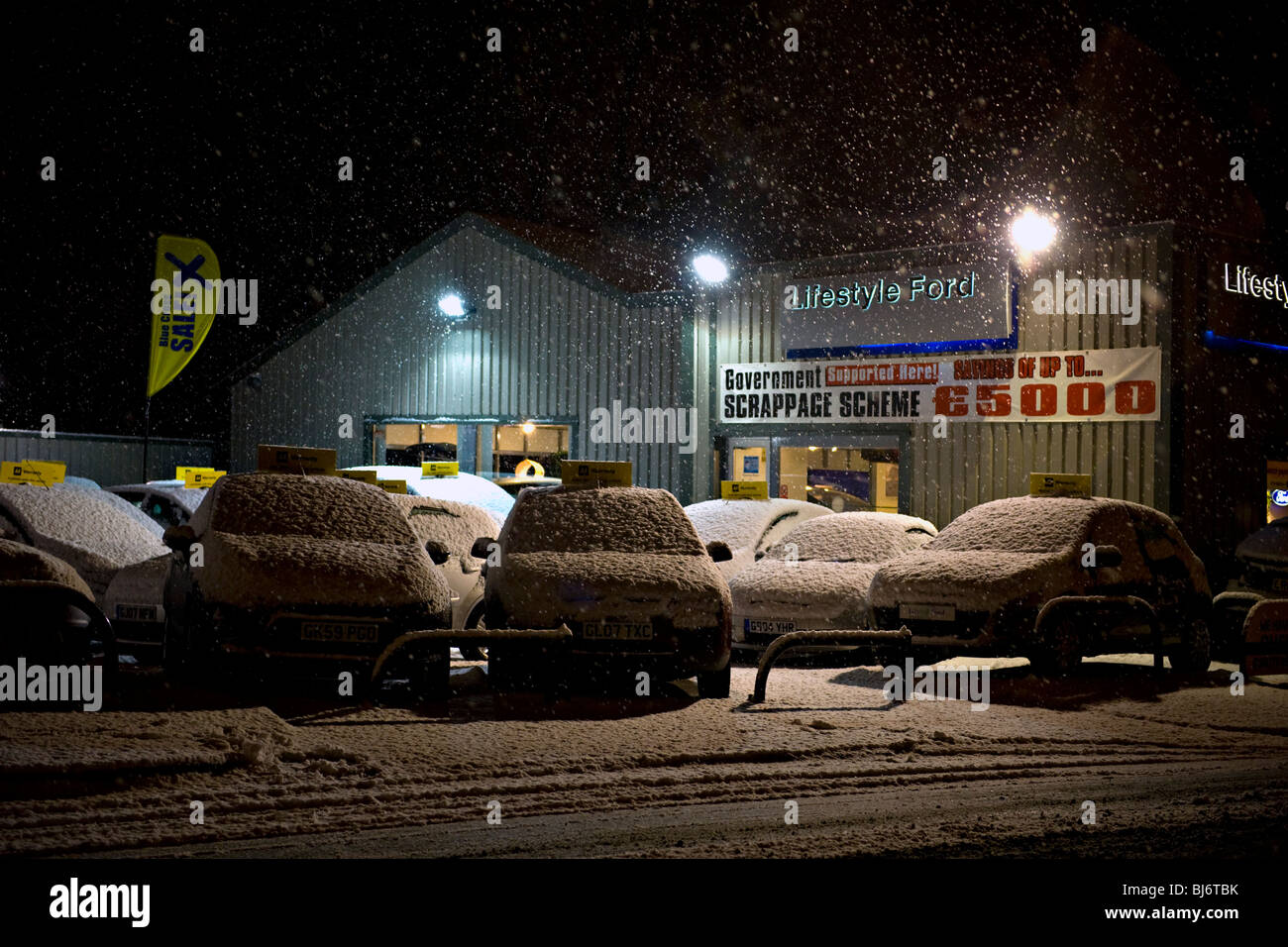 Heavy snow falling at night at road junction Stock Photo - Alamy