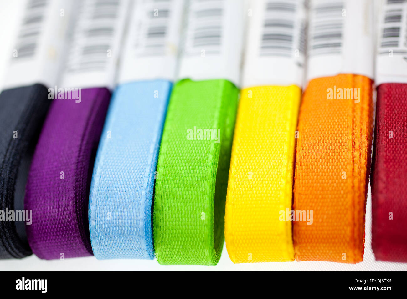 seven rainbow colored ribbons on white background. closeup Stock Photo ...