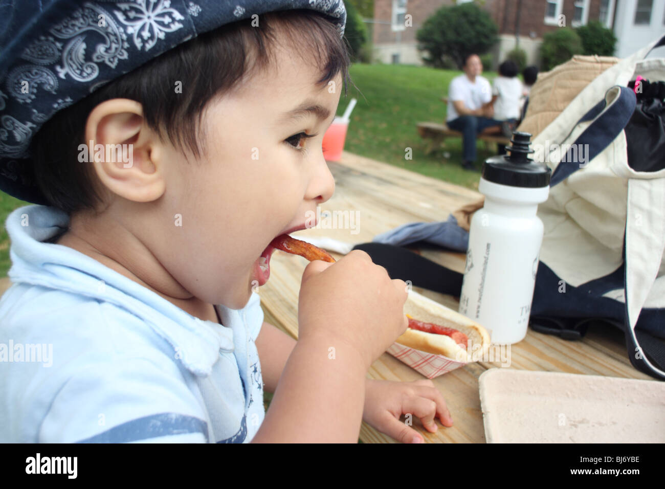 Boy eating a French fry Stock Photo - Alamy