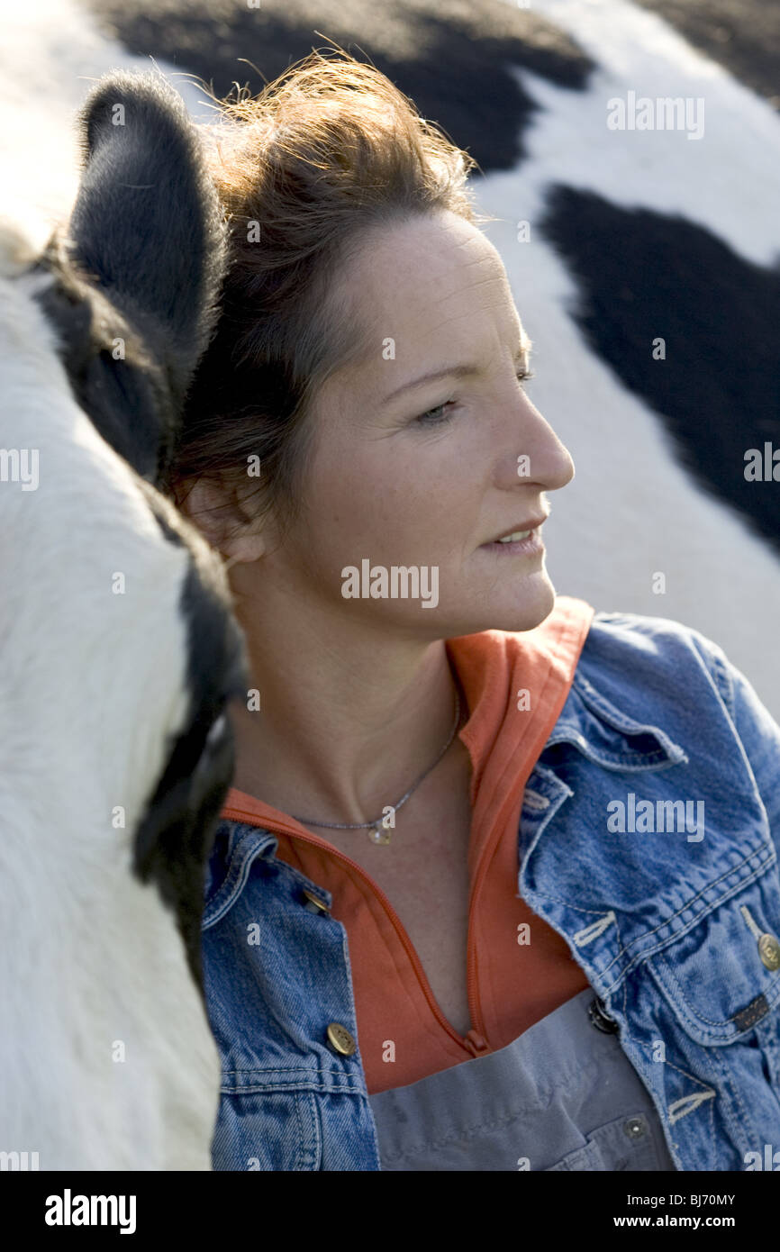 Mature Woman With Cow On Farm High Resolution Stock Photography and ...
