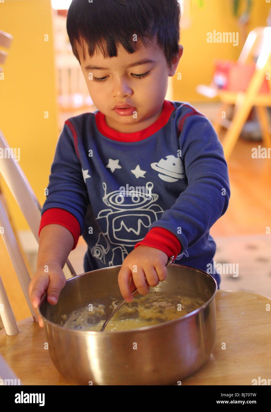 Boy stirring pancake batter Stock Photo - Alamy