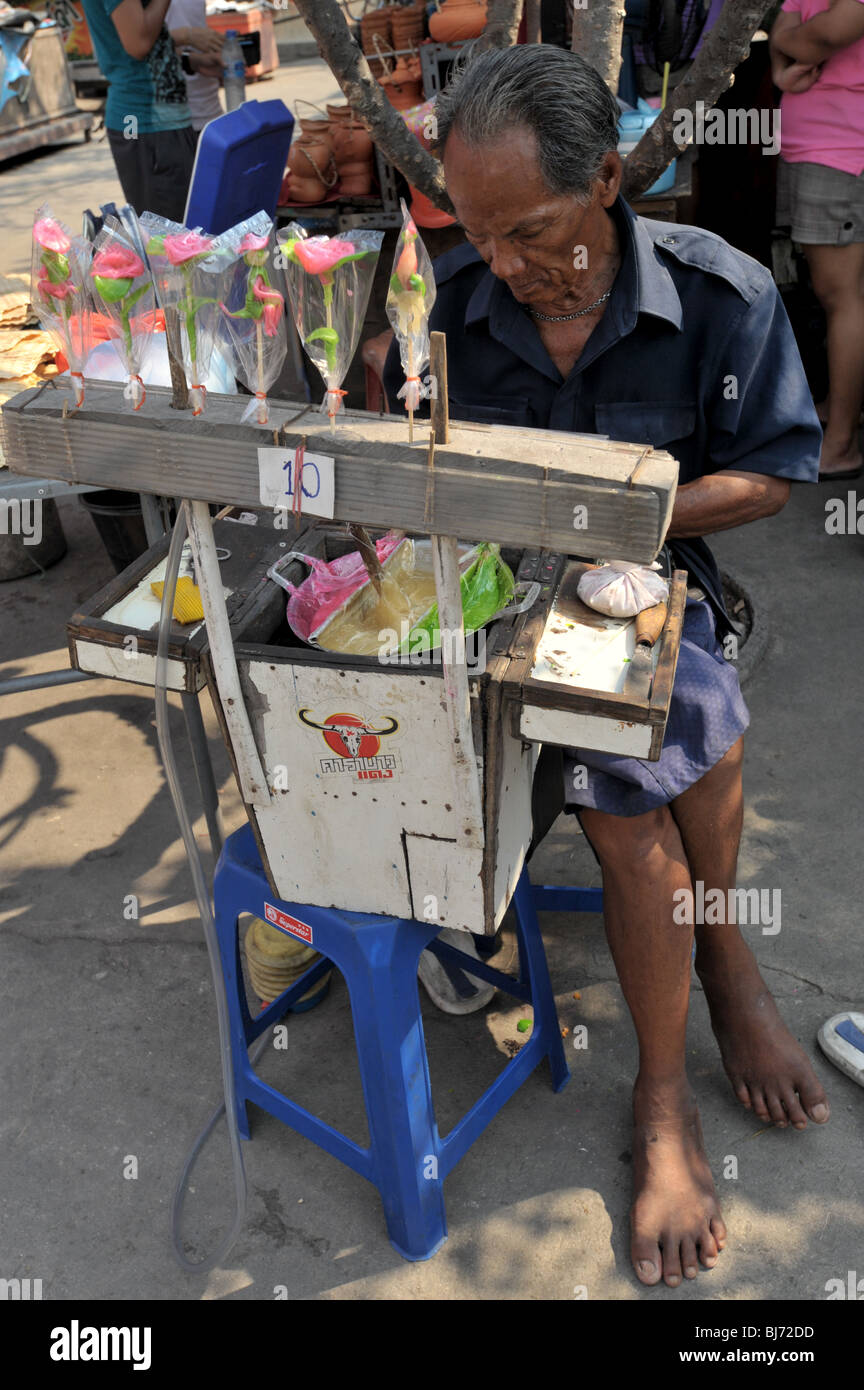 old man making ornamental decorations from colour and sugar ,ko kret ...