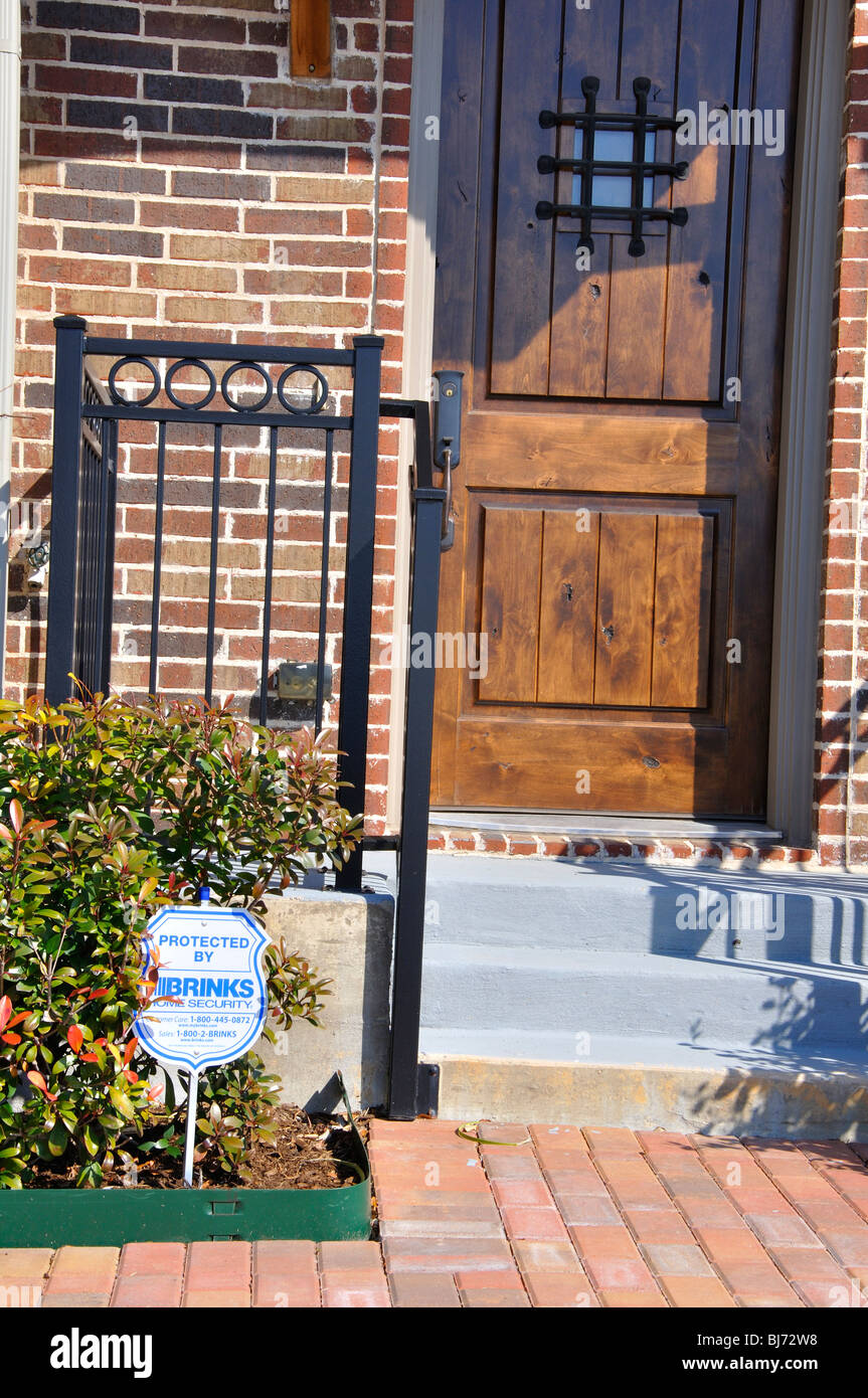 Alarm system warning sign for thieves at residential home Stock Photo ...