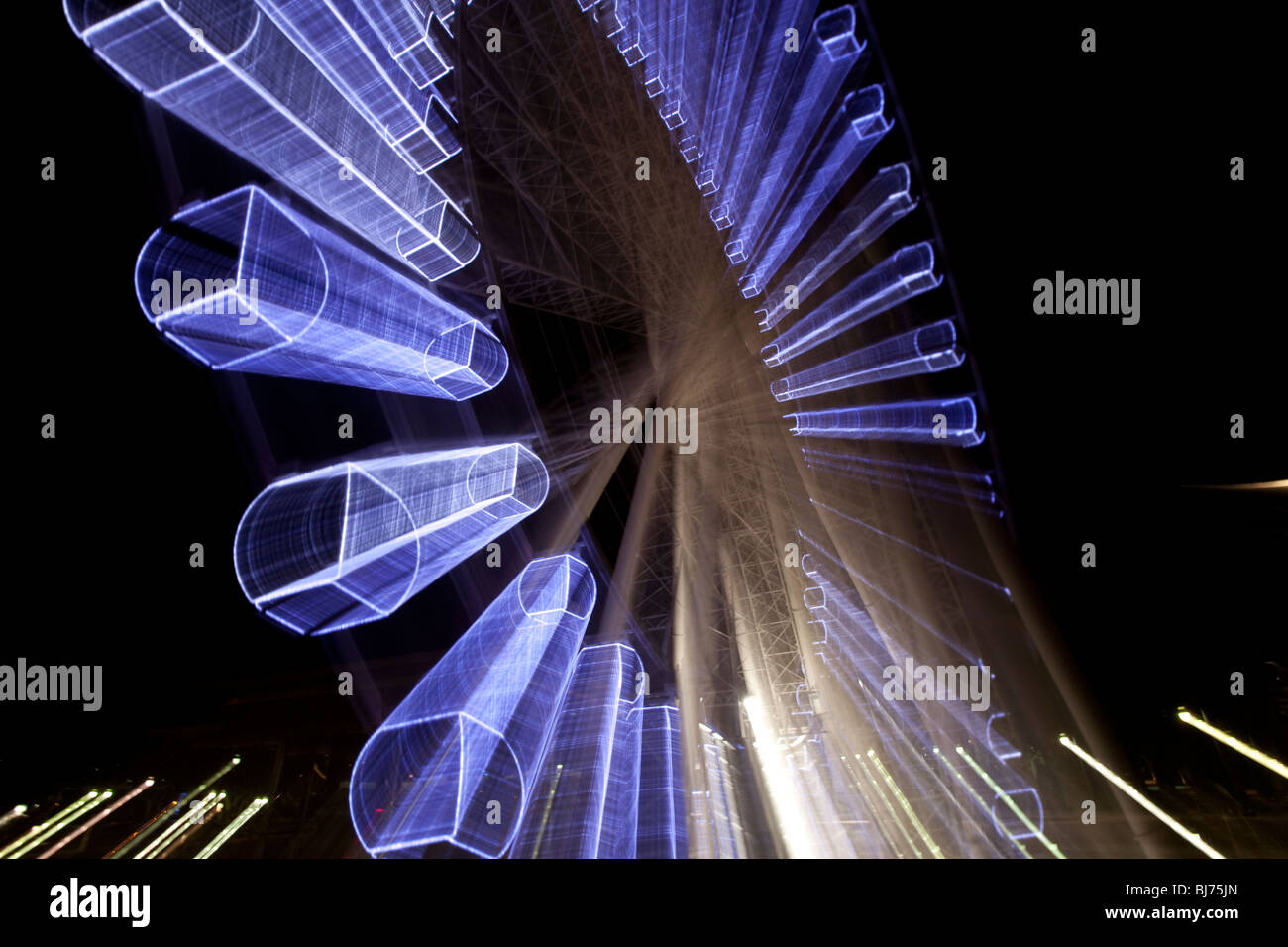 Sky wheel illuminated at night Stock Photo - Alamy