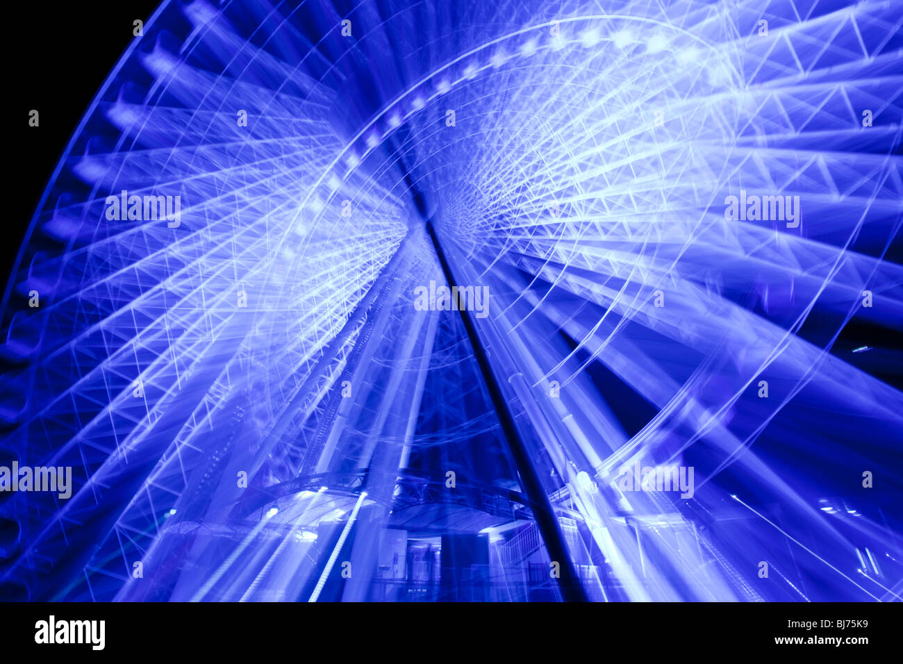 Sky wheel illuminated at night Stock Photo - Alamy