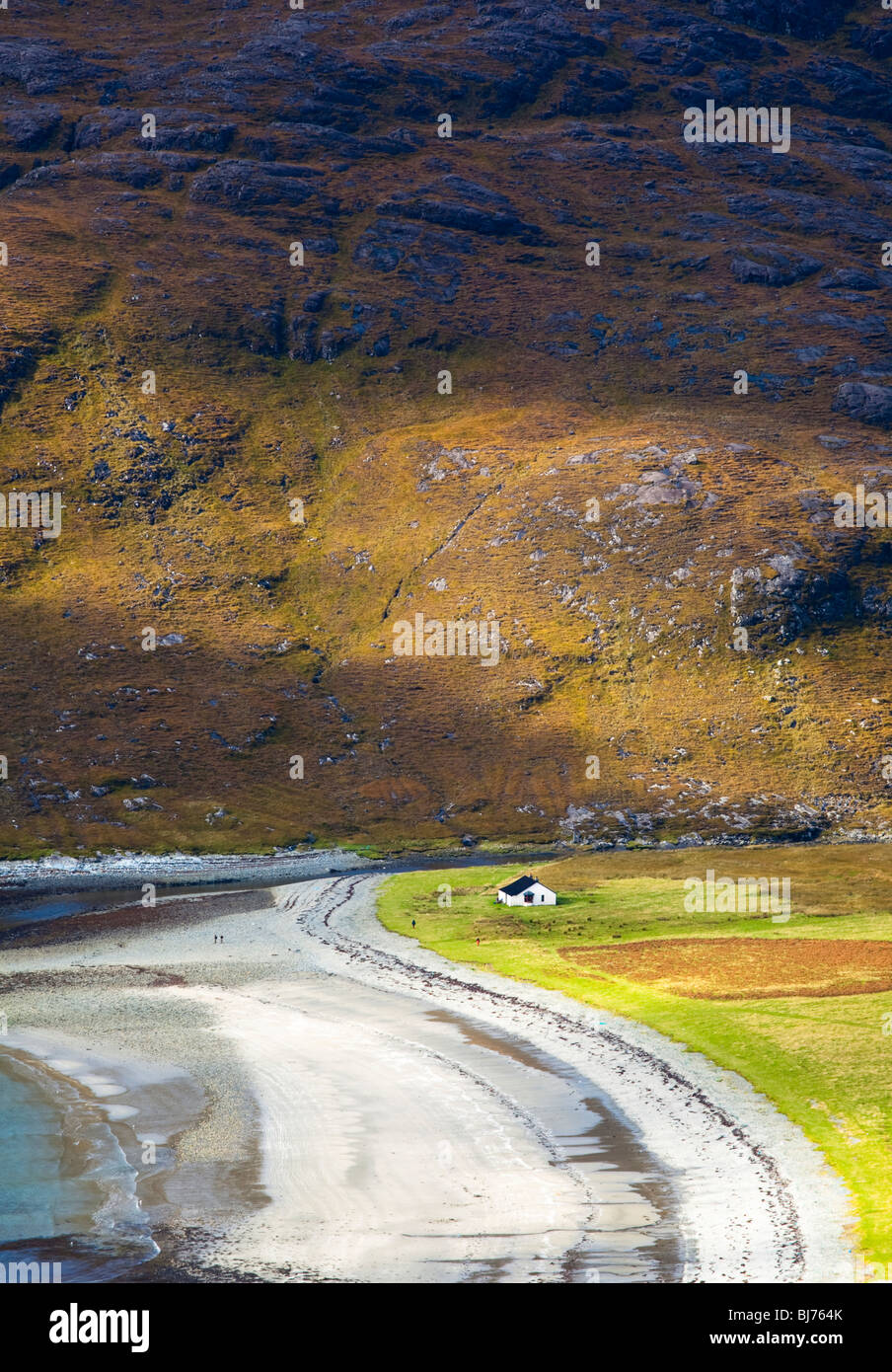 Scotland, Isle of Skye, Loch Scavaig. Breaking light on the lower hills ...