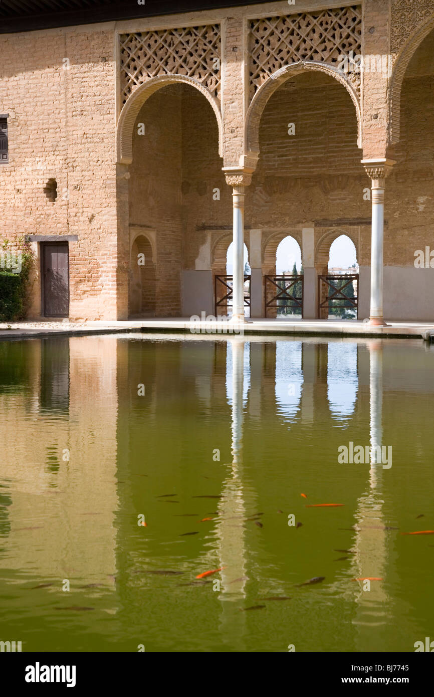 Granada, Andalusia, Spain. Portico of the Torre de las Damas reflected ...