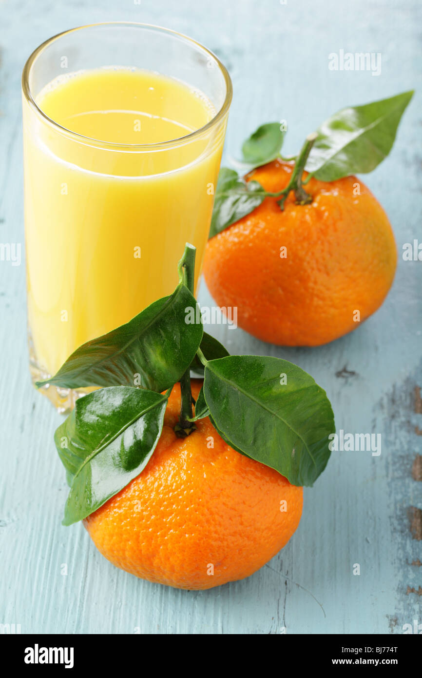 Mandarin orange and a glass of orange juice Stock Photo - Alamy