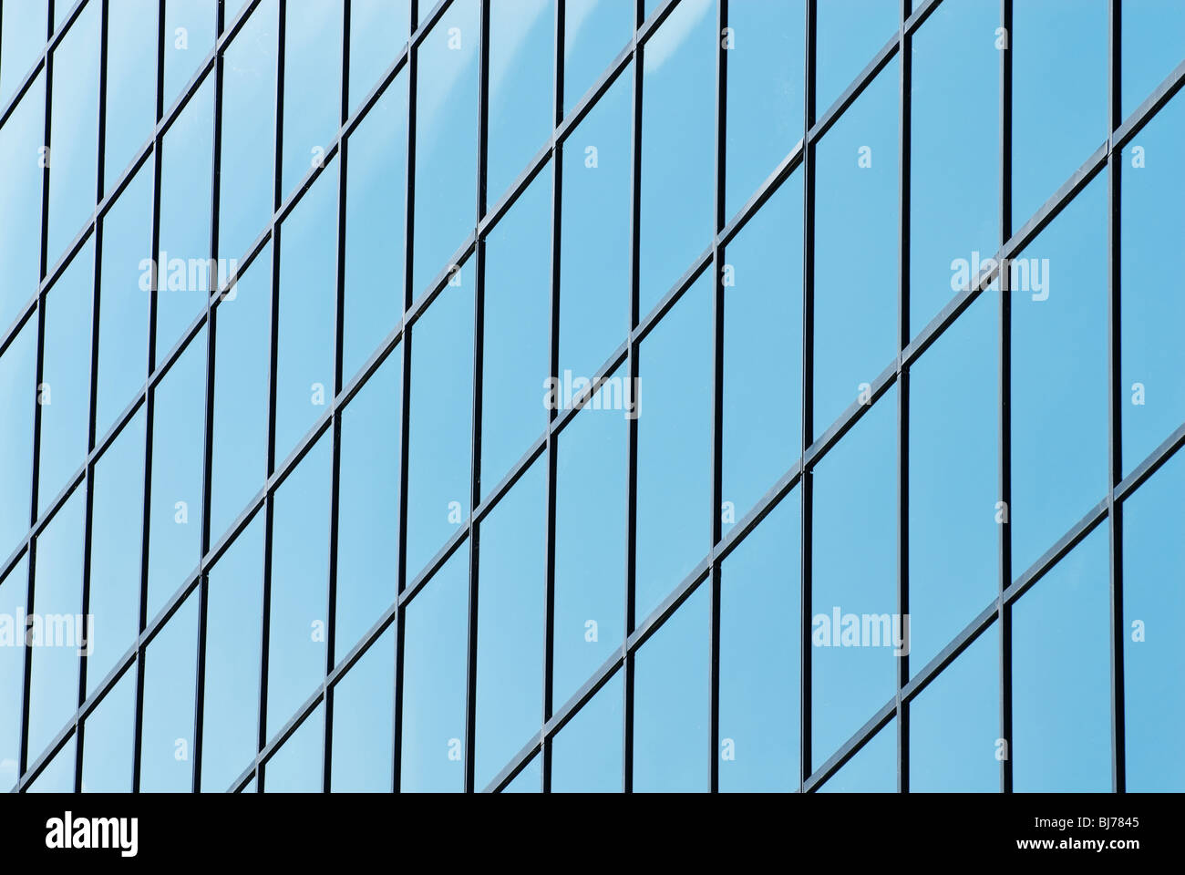 Angles and reflections on the exterior glass windows on a modern ...