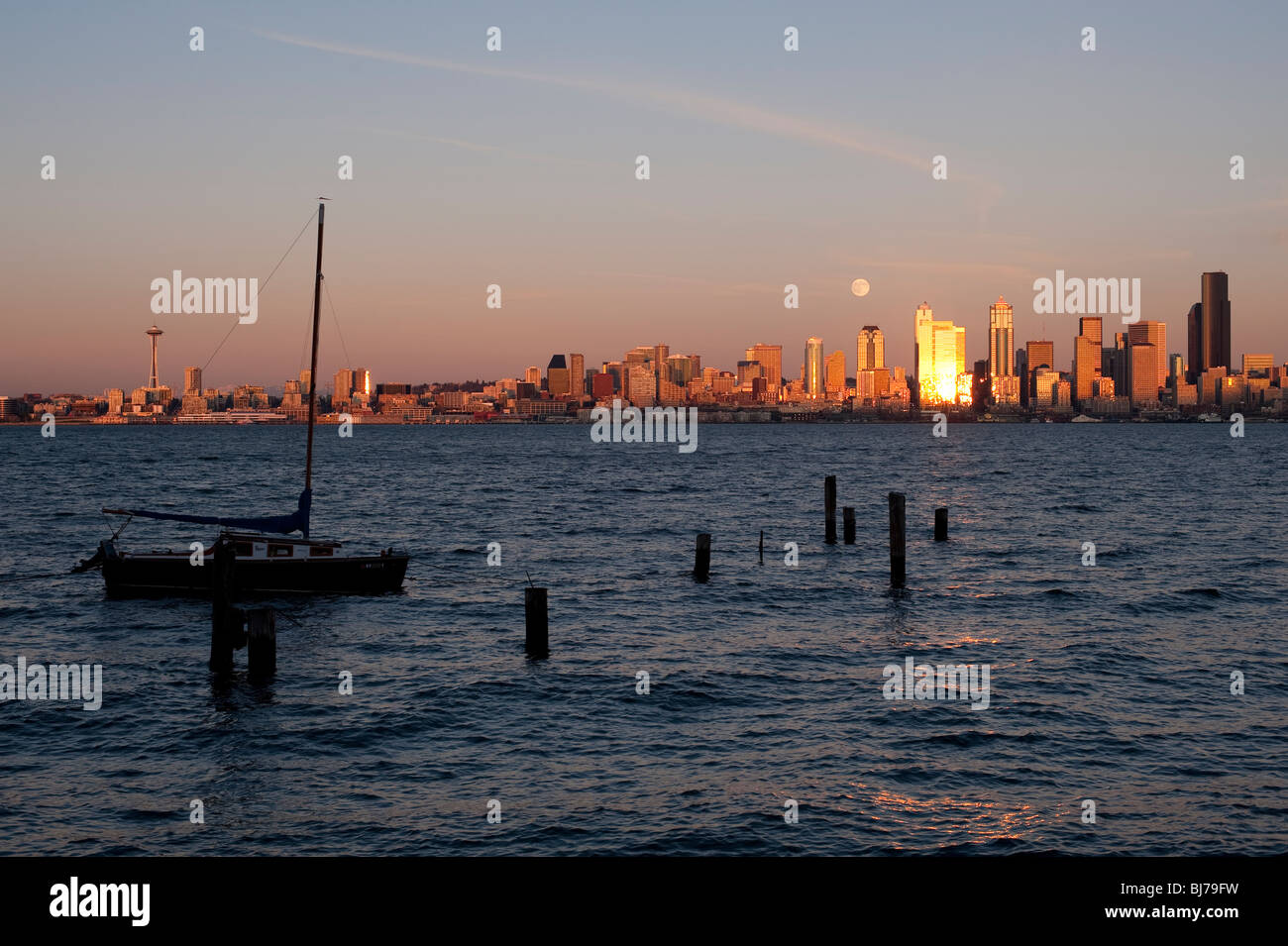 Seattle Skyline with moonrise over Elliott Bay at sunset Stock Photo ...