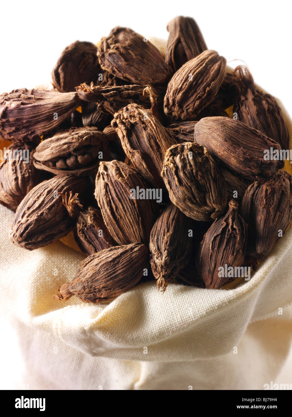 Whole black cardamoms pods in a spice sack bag Stock Photo - Alamy