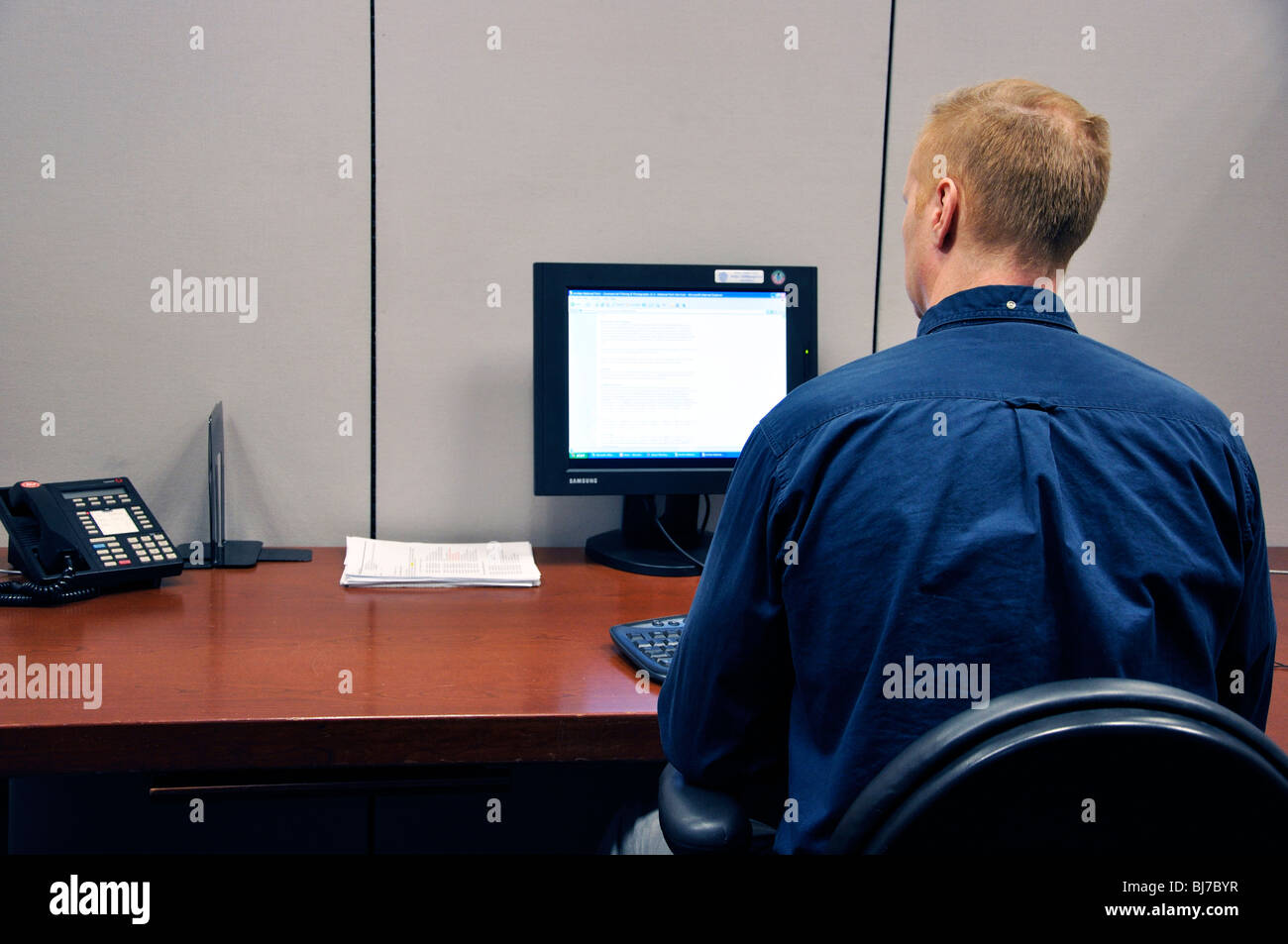 Office worker in his cubicle Stock Photo - Alamy