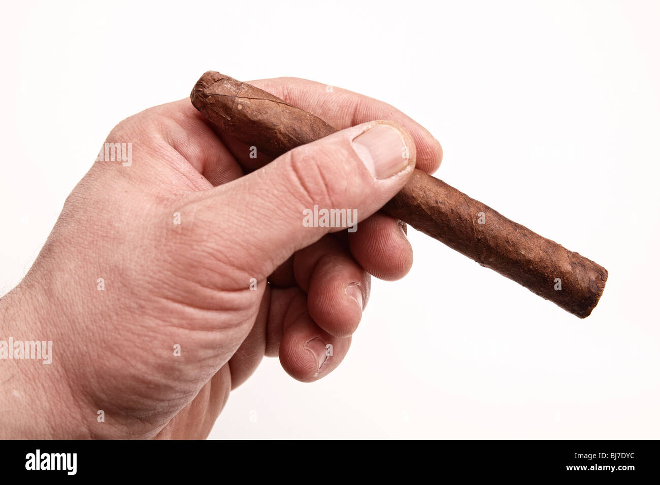 Cigar in hand Stock Photo - Alamy