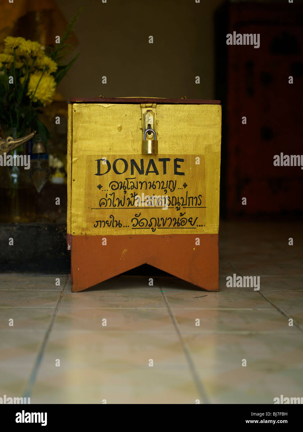 Gold donation box in a thai temple Stock Photo - Alamy