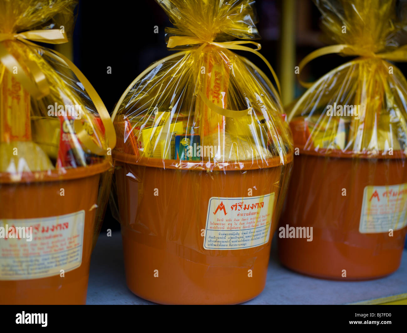 Buckets for donation to the monks in Thailand Stock Photo - Alamy
