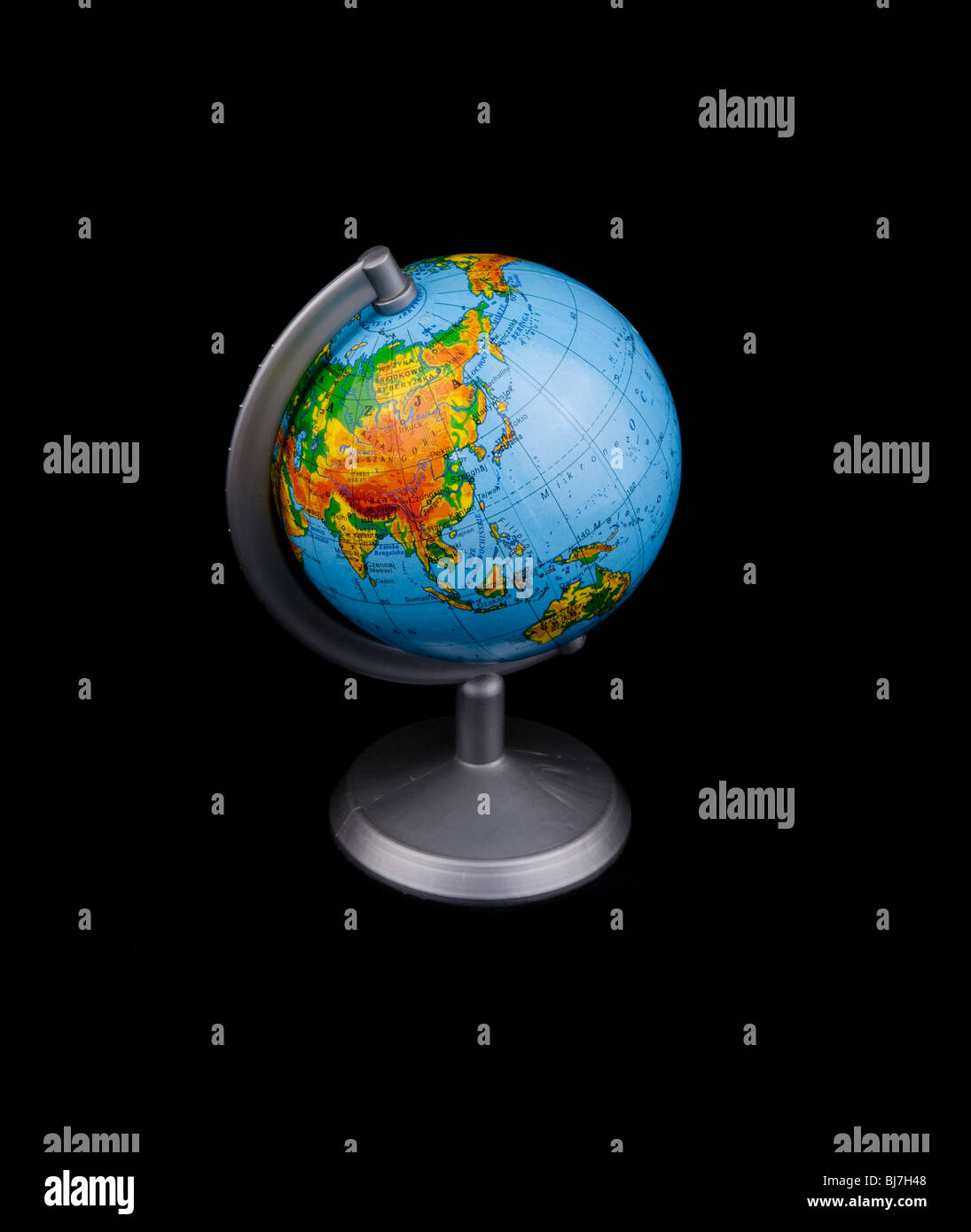 Small globe on black background Stock Photo - Alamy
