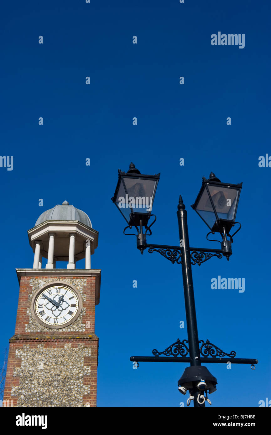 Clock tower and traditional lamp post against a clear Winter blue sky ...
