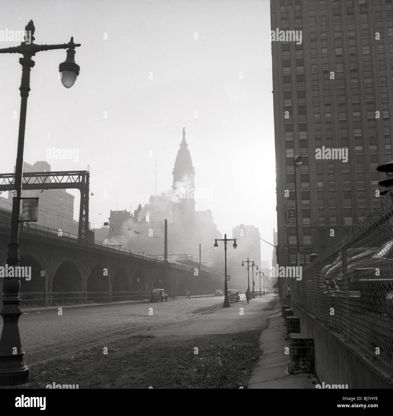 Street view of downtown Philadelphia next to tracks that run along ...