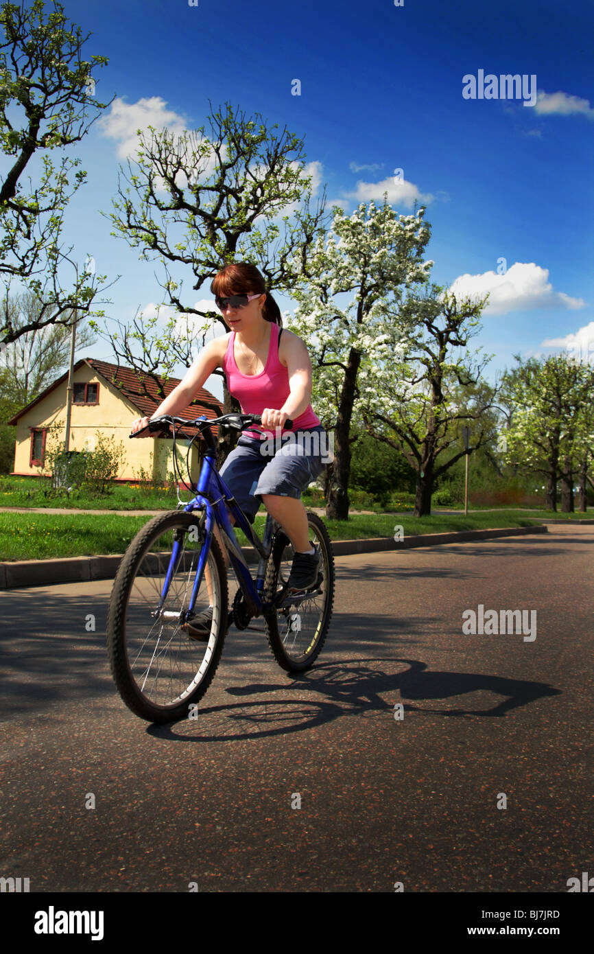 young lady driving a cycle Stock Photo - Alamy