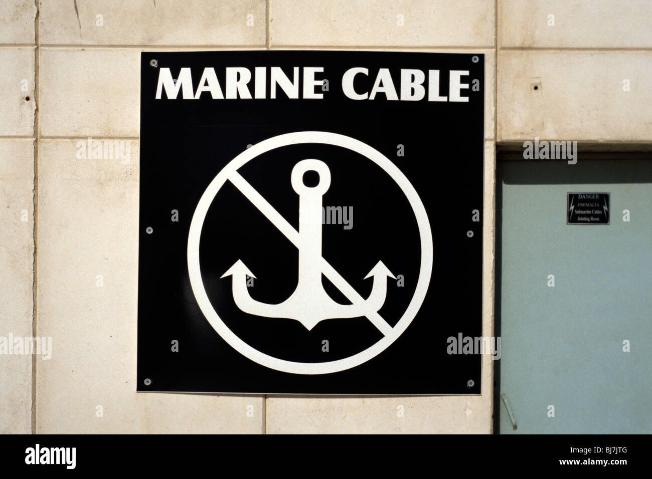 Sign warning ships of marine cables Stock Photo - Alamy