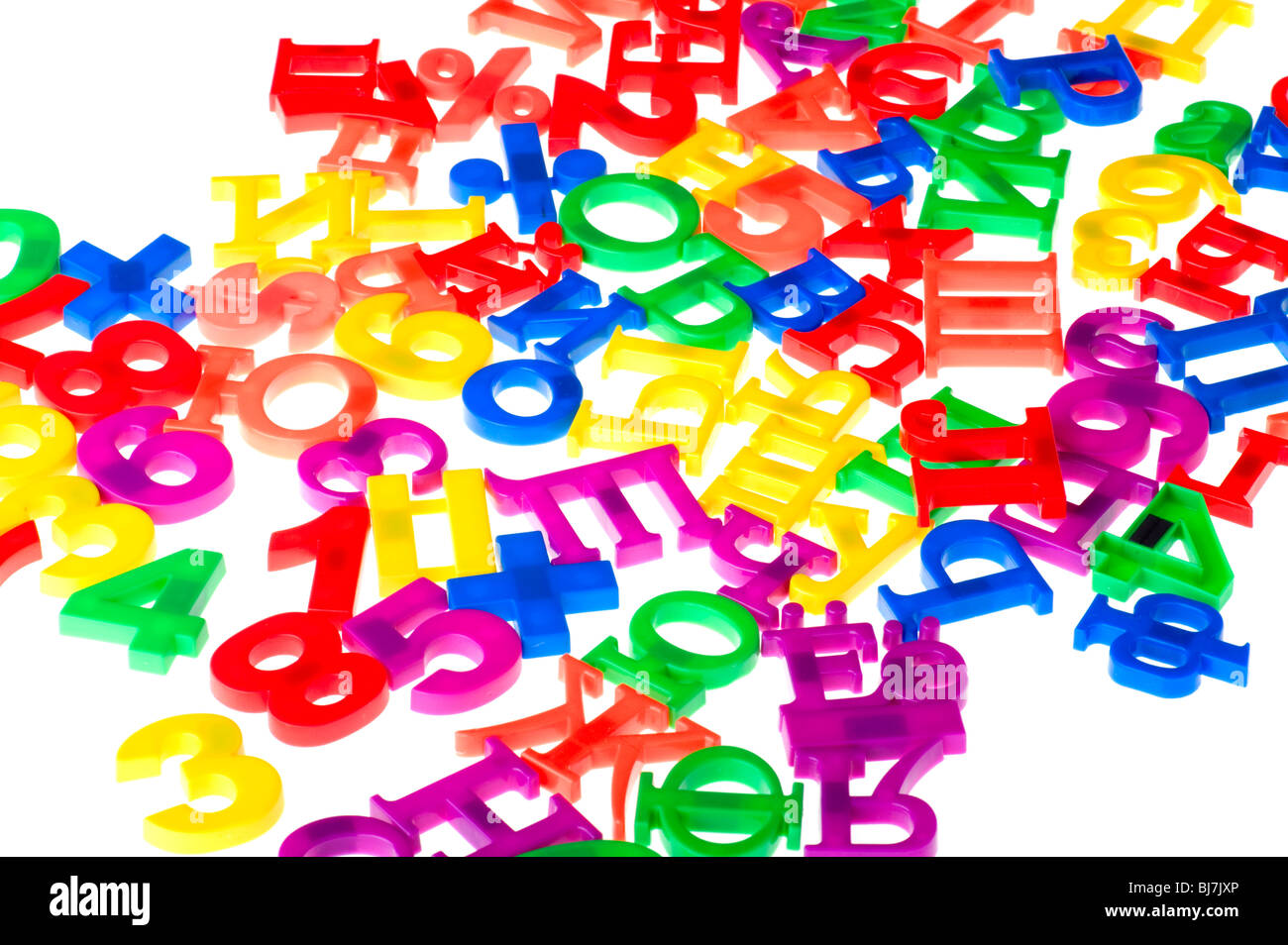 object on white - toy plastic letters and numbers Stock Photo - Alamy