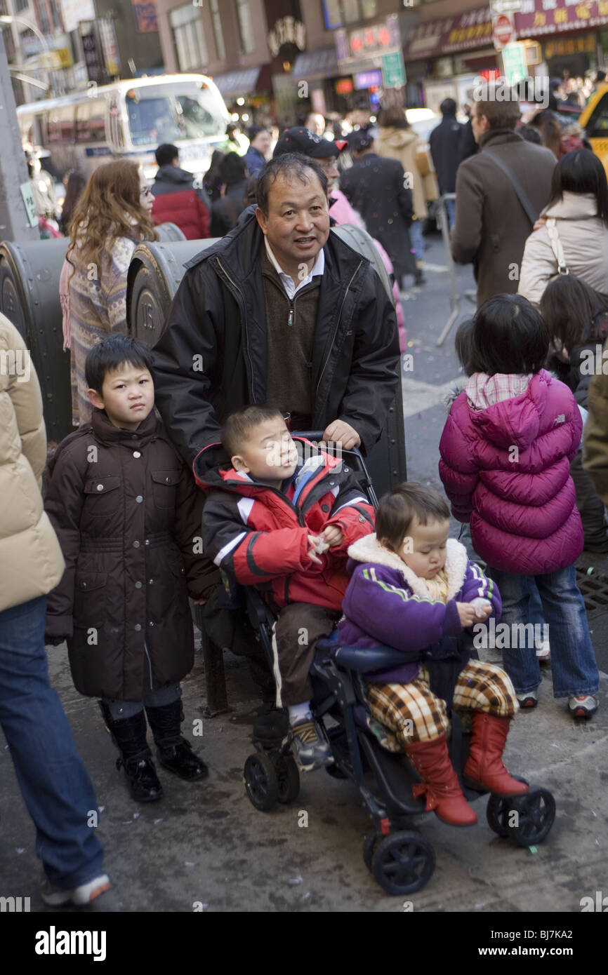 Chinese father with three children during Chinese New Year celebrations ...