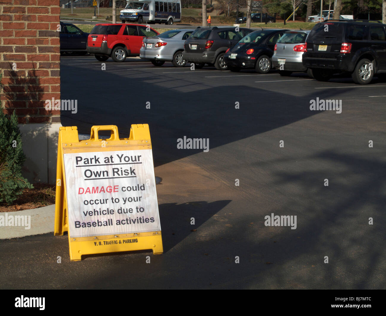Baseball damage warning sign. Stadium parking lot, Vanderbilt ...