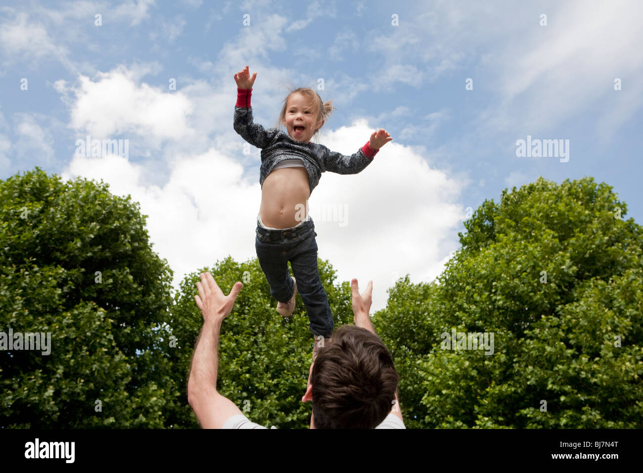 Man throwing child air catching hi-res stock photography and images - Alamy