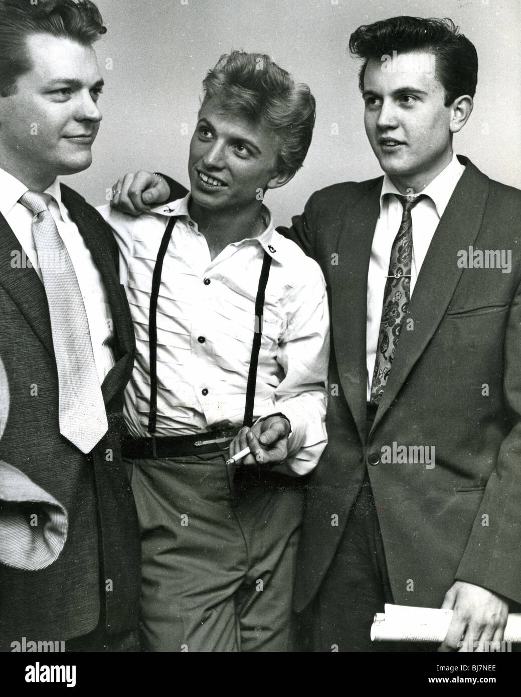 TOMMY STEELE (centre) with fellow UK rock singer Terry Dene about 1958 ...