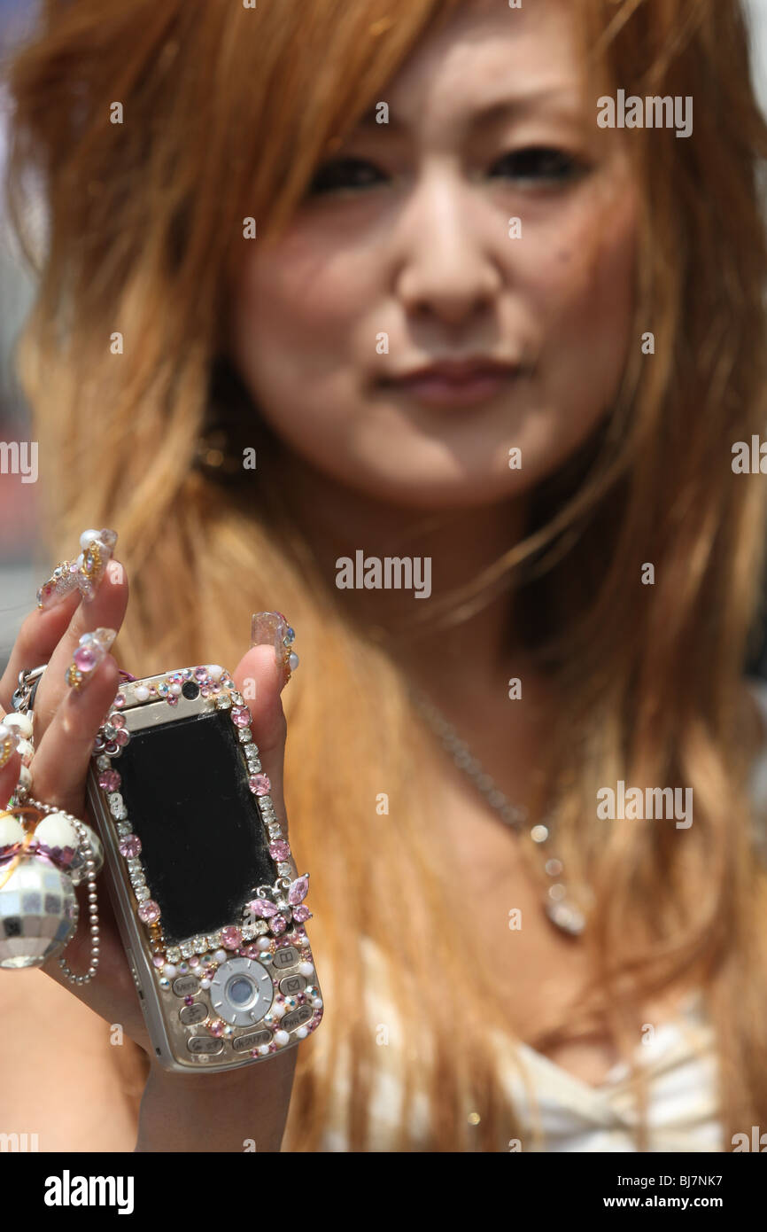 Japanese mobile telephone use by commuters and public in Tokyo, Japan ...