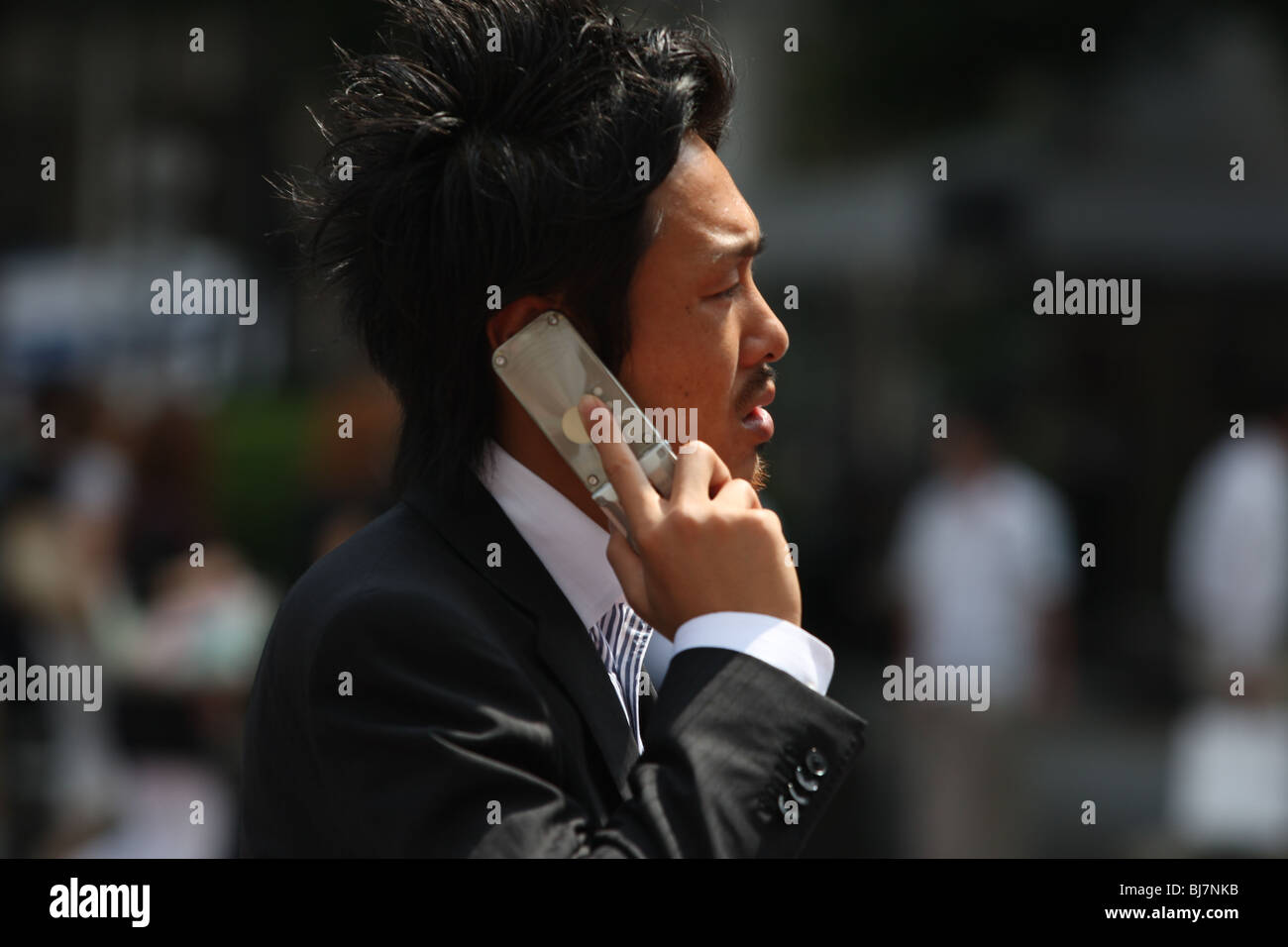 Japanese mobile telephone use by commuters and public in Tokyo, Japan ...