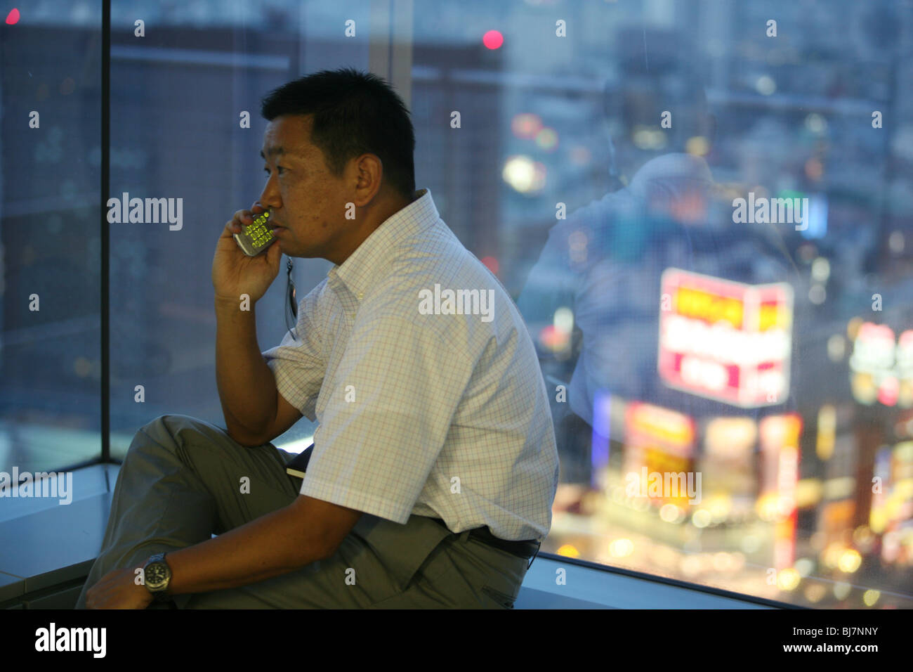 Japanese mobile telephone use by commuters and public in Tokyo, Japan ...