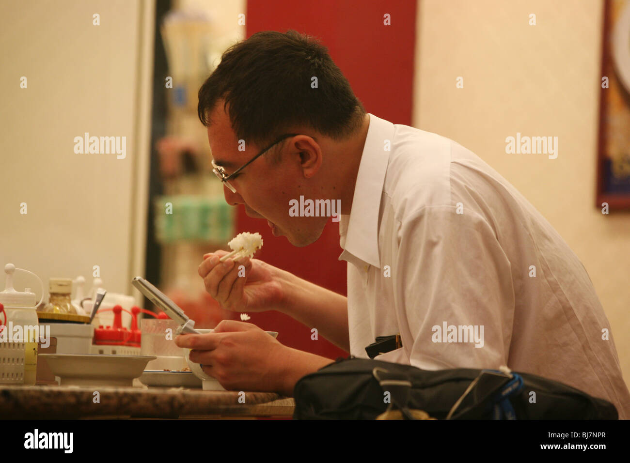 Japanese mobile telephone use by commuters and public in Tokyo, Japan ...