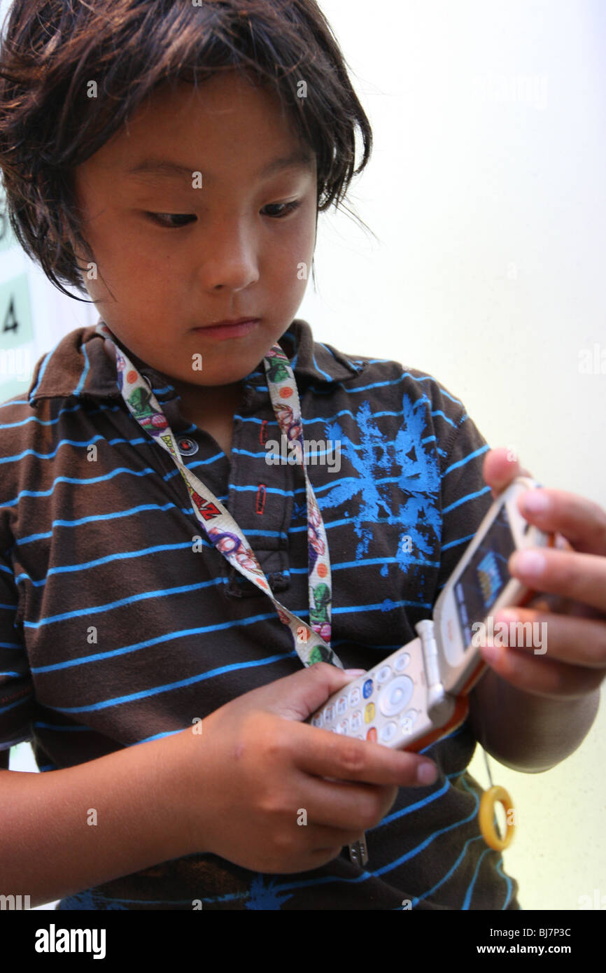 Boy with child friendly mobile telephone, with child security functions ...