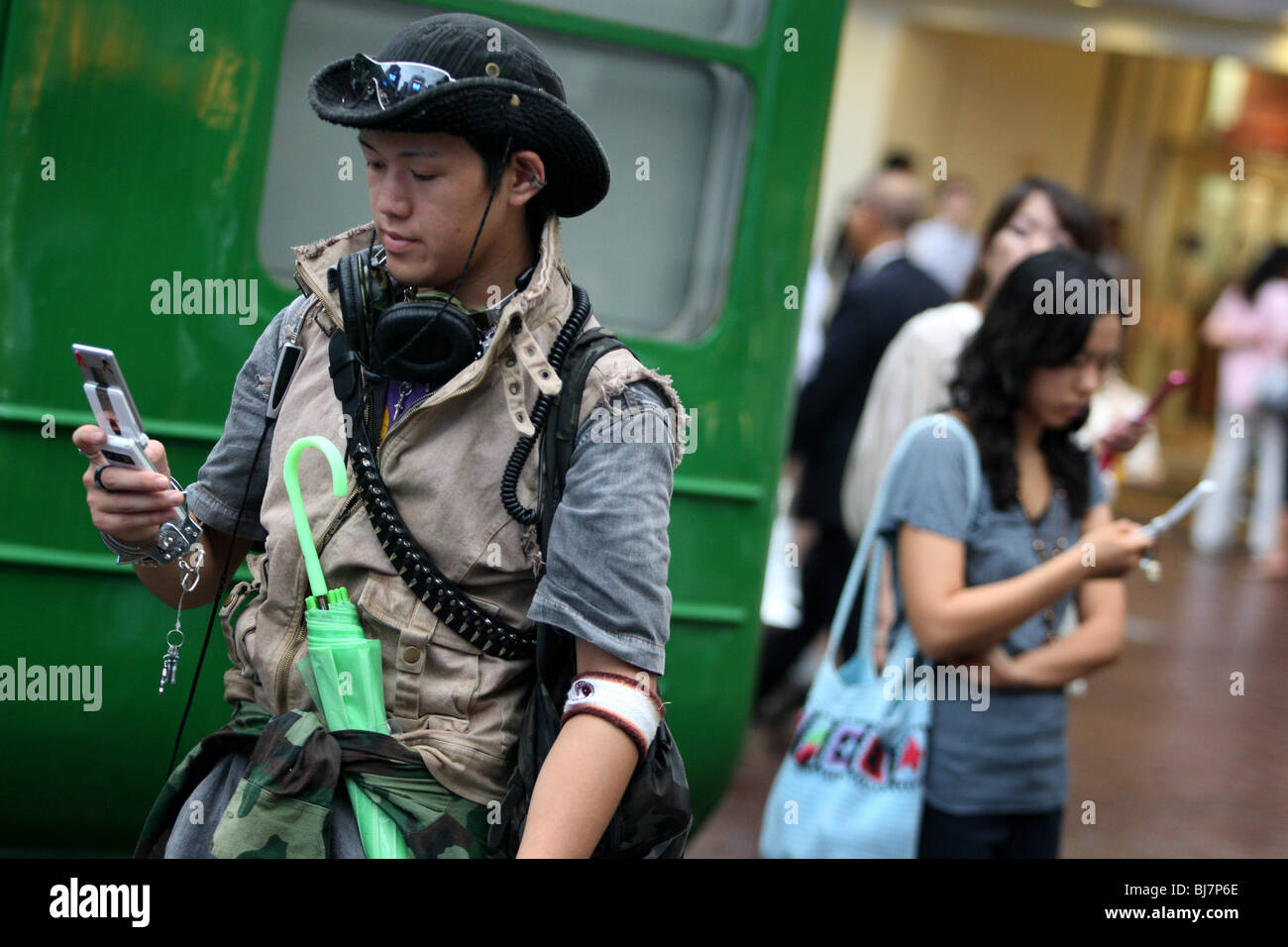 Japanese mobile telephone use by commuters and public in Tokyo, Japan ...
