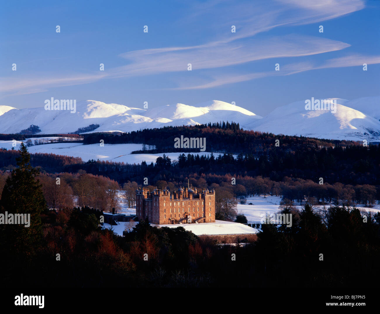 Scottish castle Drumlanrig Castle in a winter landscape with the snow ...