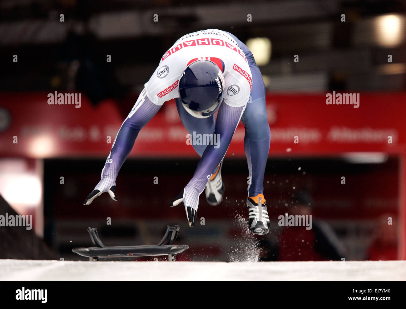 Skeleton Slider Leaps onto Sled at the start of the run Stock Photo - Alamy
