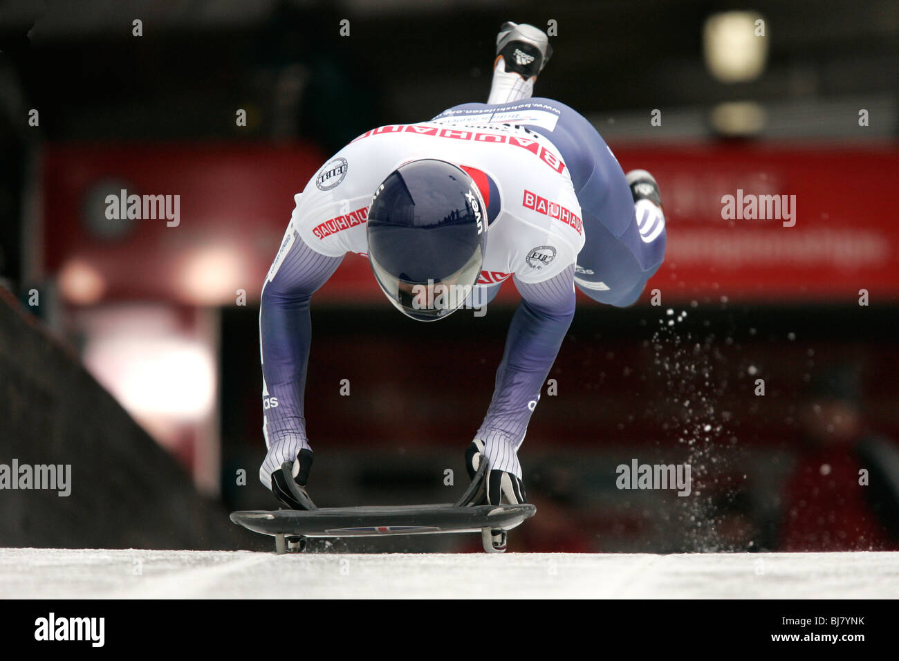 Skeleton Slider Leaps onto Sled at the start of the run Stock Photo - Alamy